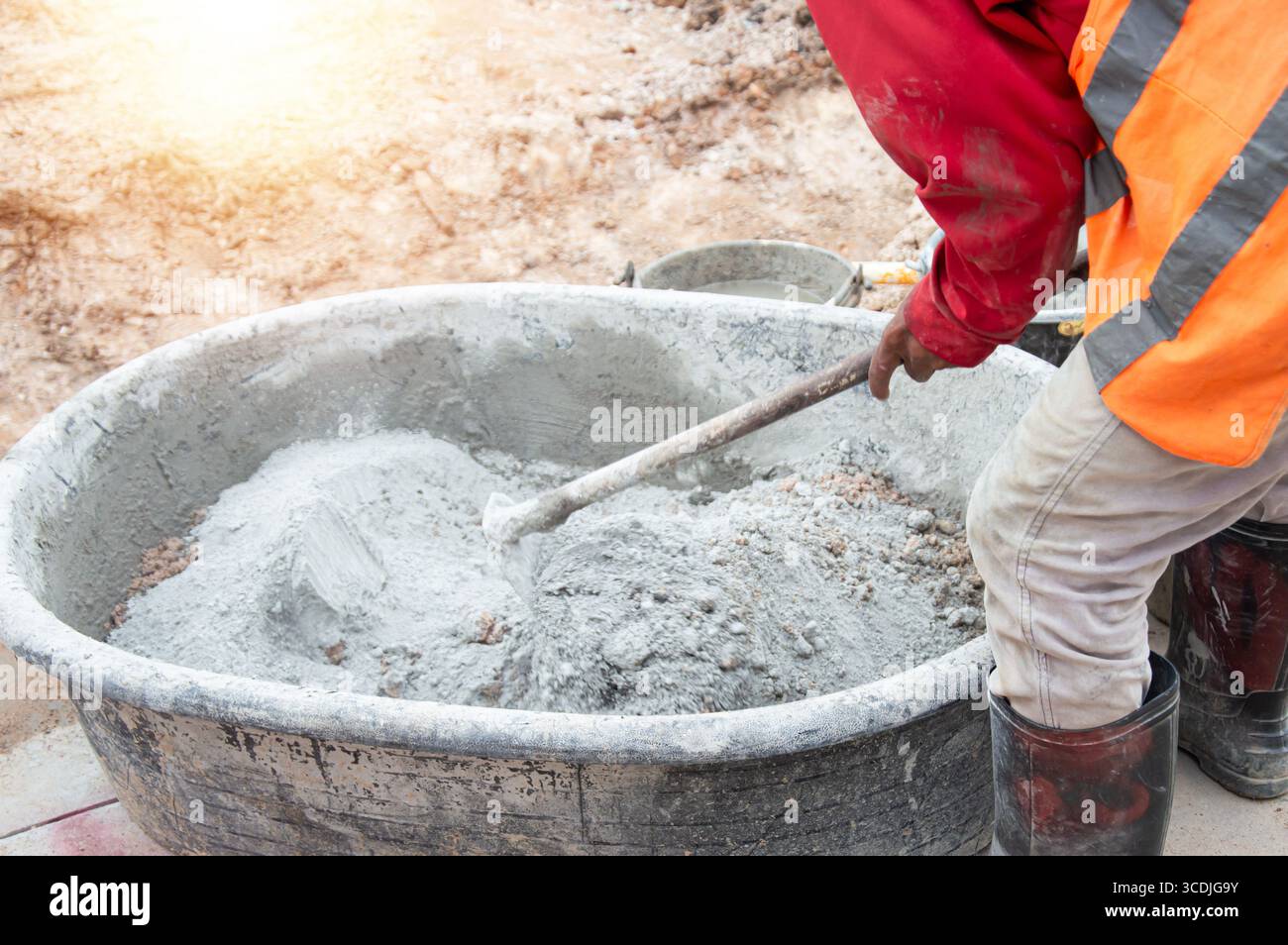 Workers are mixing cement in a mixing tank Stock Photo - Alamy