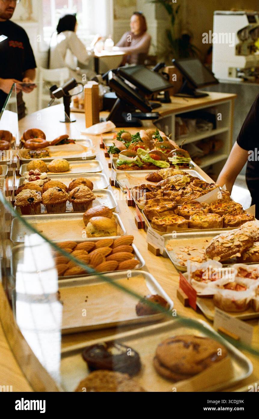 Display of assorted cakes, pastries, and baked goods at Gail’s Bakery ...