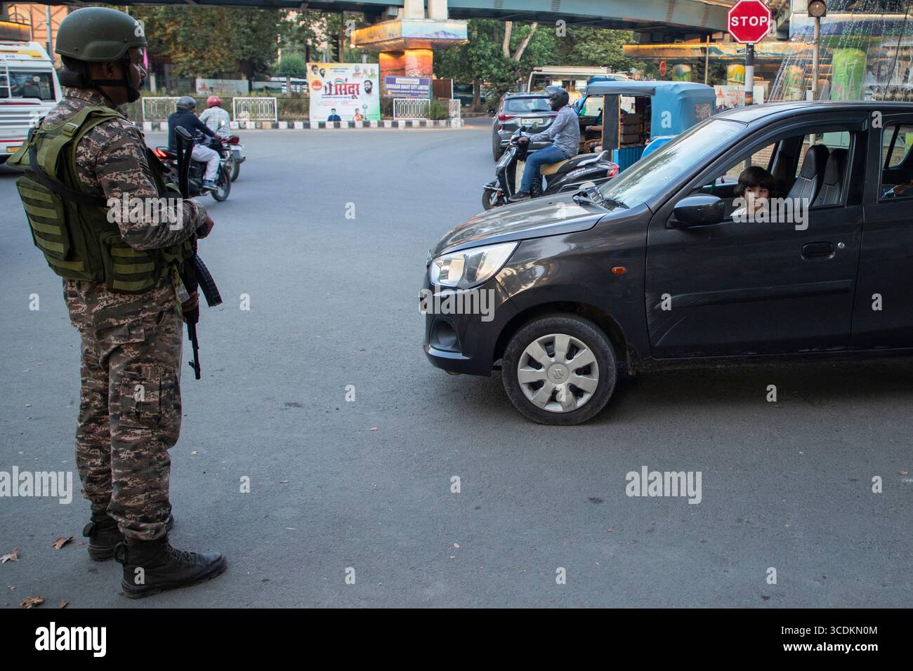 August 14, 2025, Srinagar, Jammua And Kashmir, India: A Kashmiri girl looks at an Indian ...