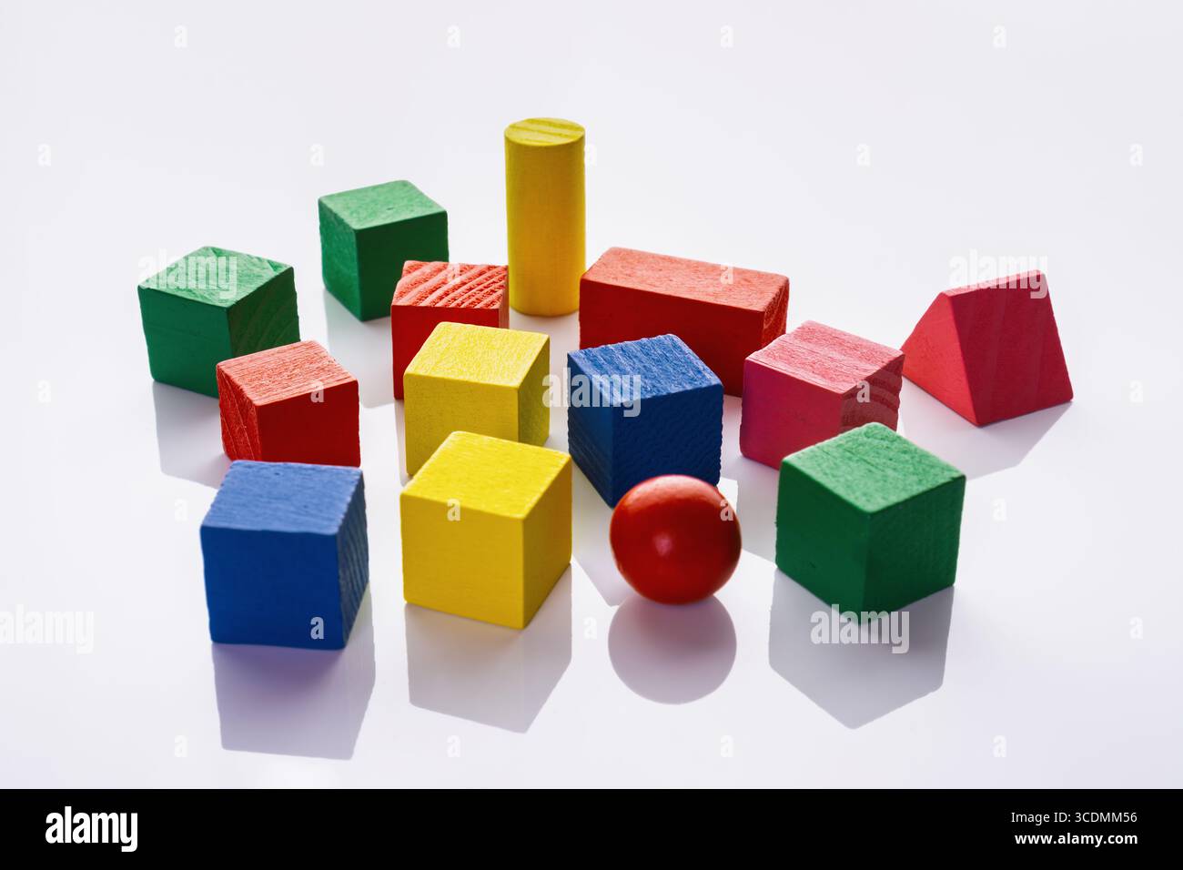 A creative arrangement of colorful wooden blocks of various shapes on a ...