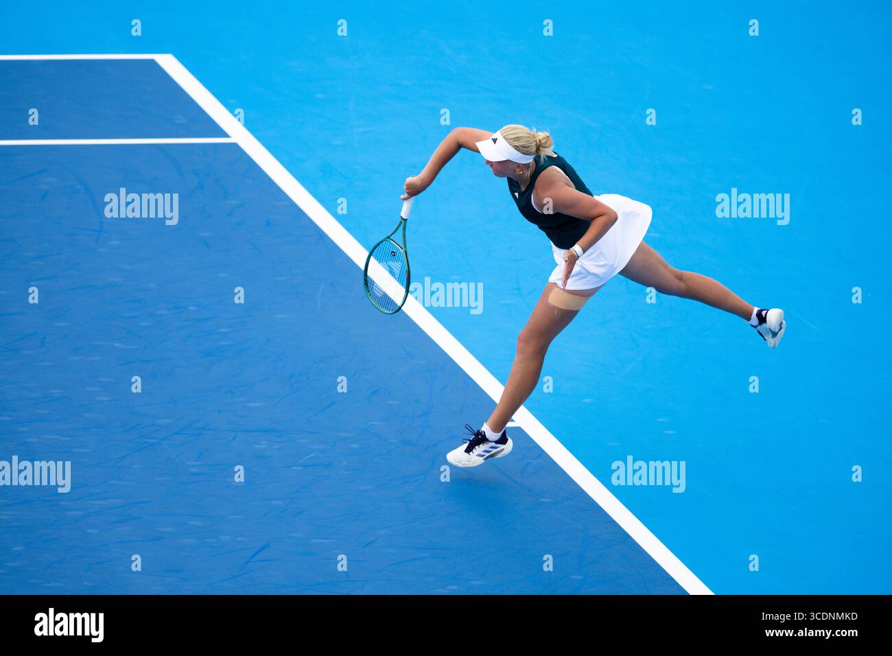 MASON, OHIO - AUGUST 13: Clara Tauson of Denmark serves against ...