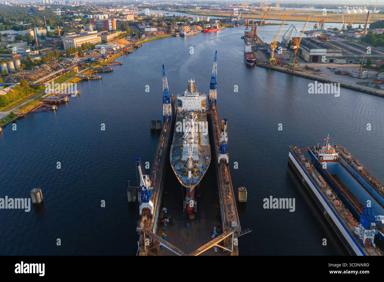 Shipyard in Riga, Latvia with Docked Vessel and Cranes Stock Photo - Alamy