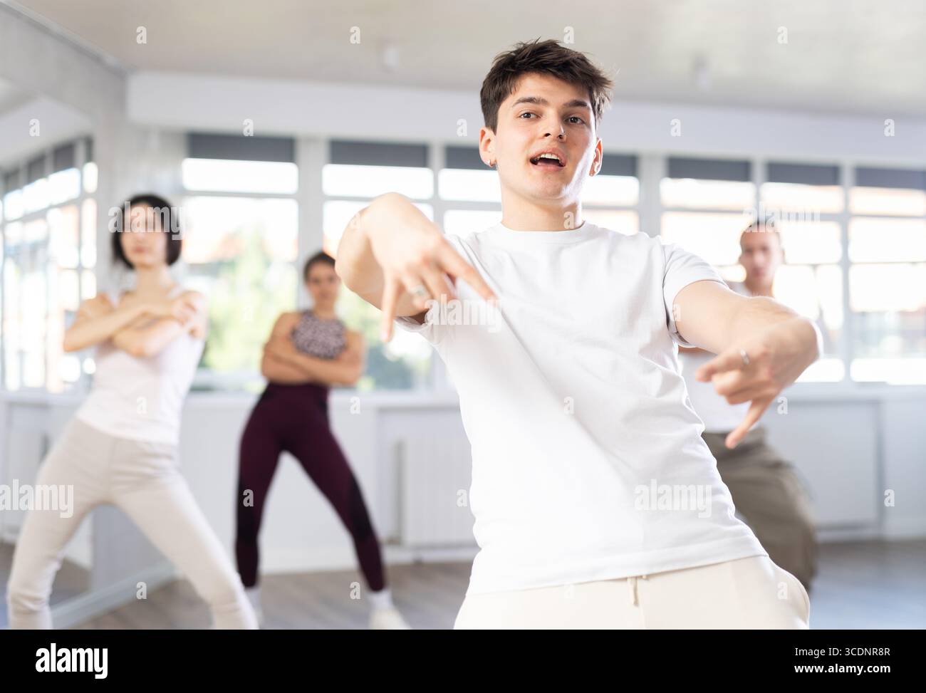 Guy enjoys active dancing, learns new movements, moves synchronously ...