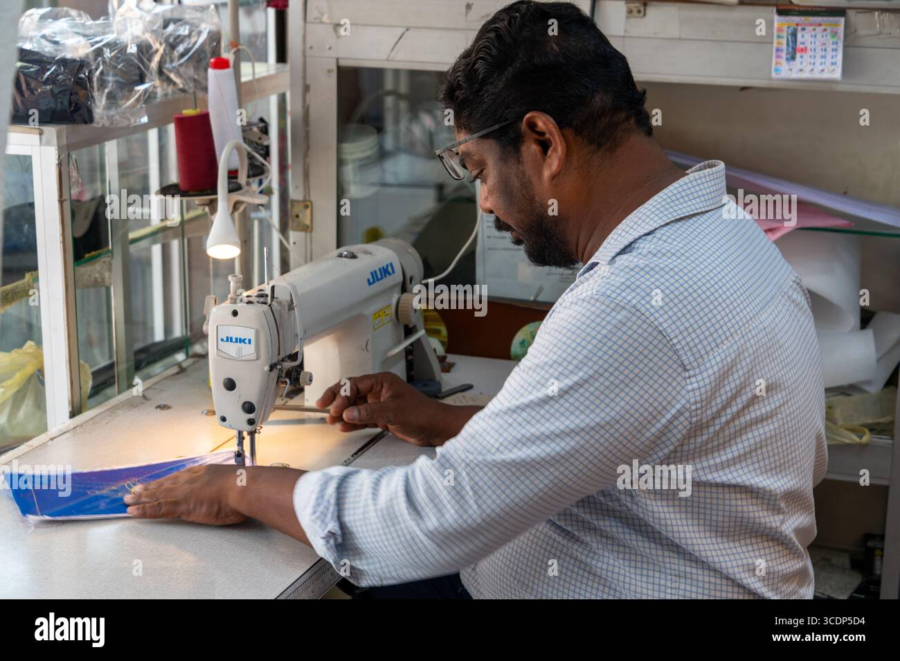 A hat maker at O.S.M Mohamed Sheriff Songkok makers on Lebuh King in ...