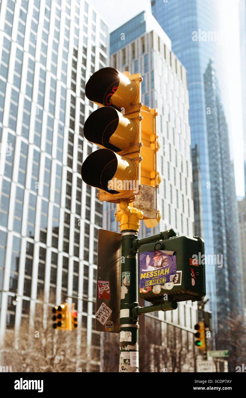 Traffic light and street scene in New York City, with urban buildings ...