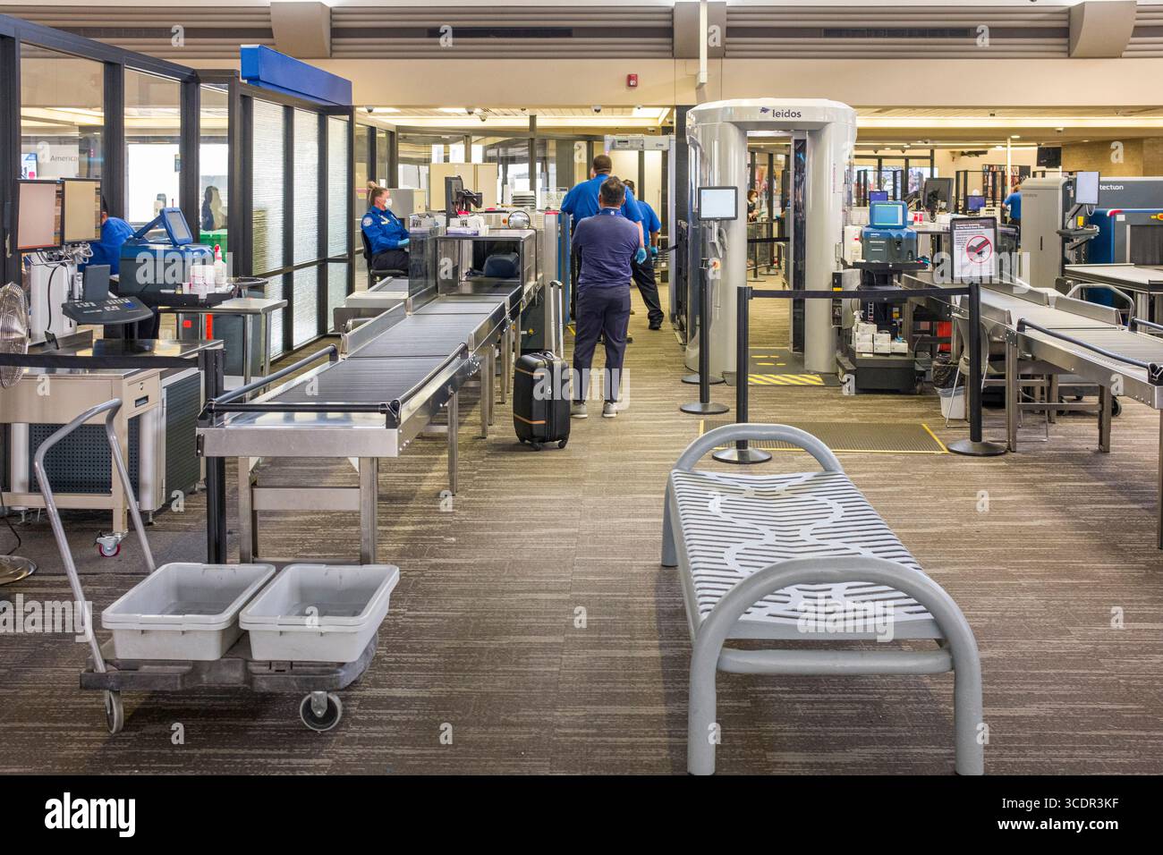 Passengers going through TSA security check point in concourse A at ...