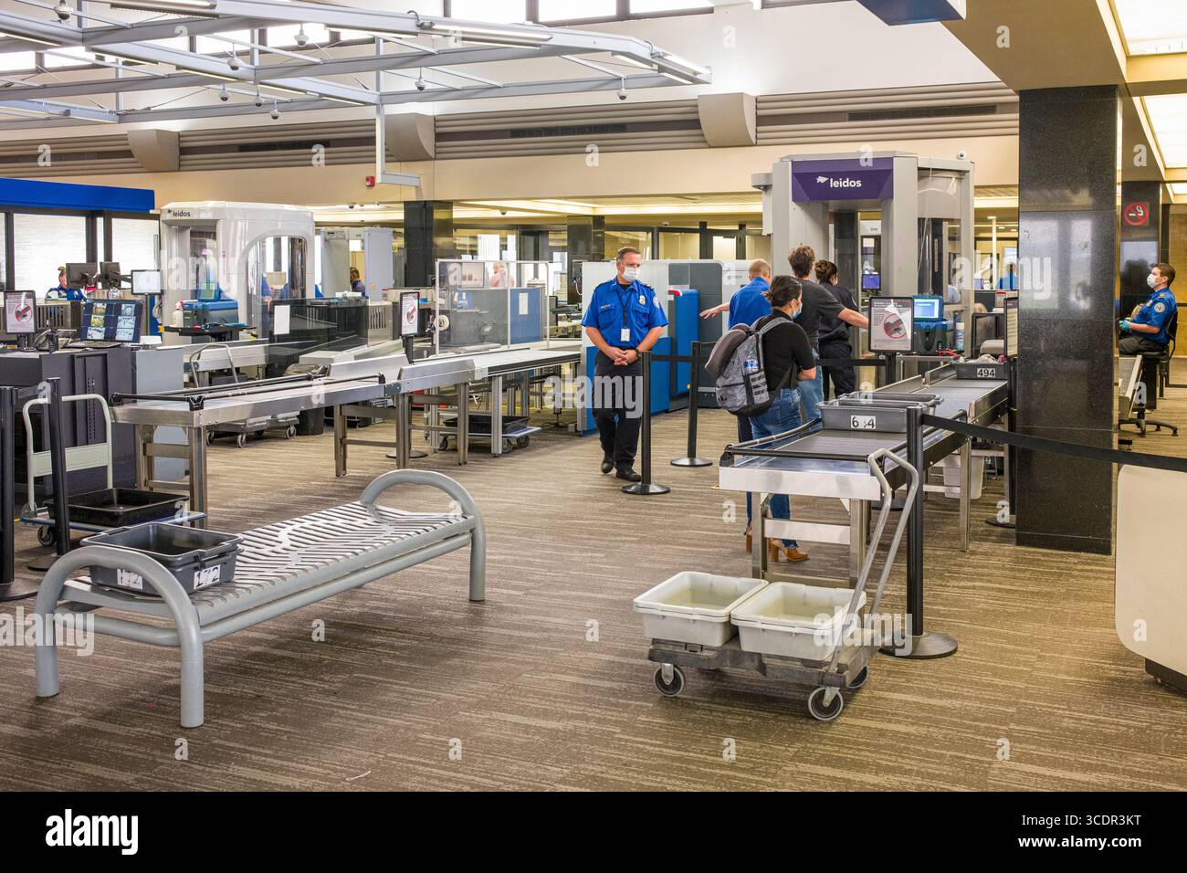 Passengers going through TSA security check point in concourse A at ...