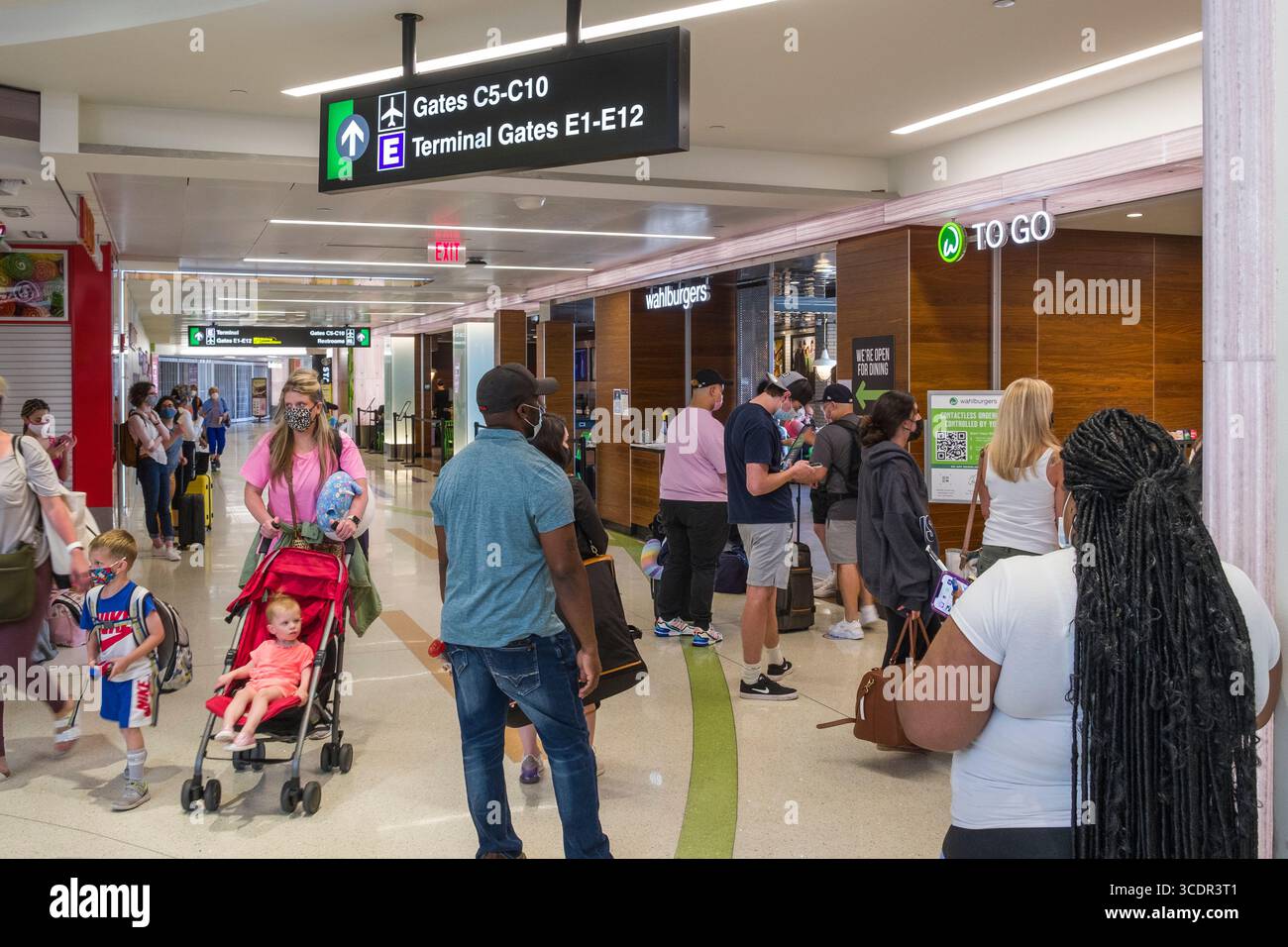 People waiting for takeout food orders inside Terminal C at Logan ...