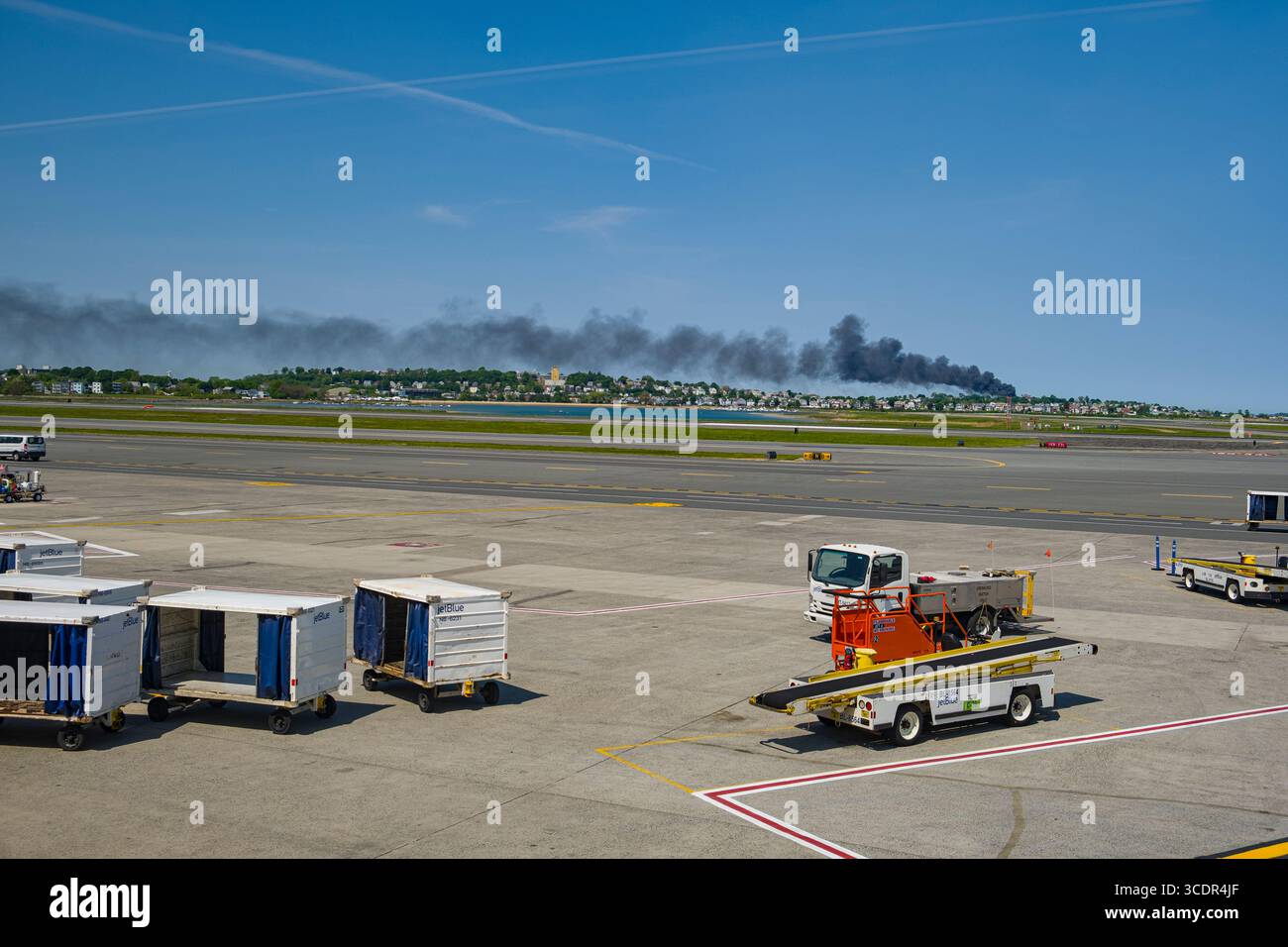 Black smoke rising from Winthrop neighborhood seen from Terminal C at ...