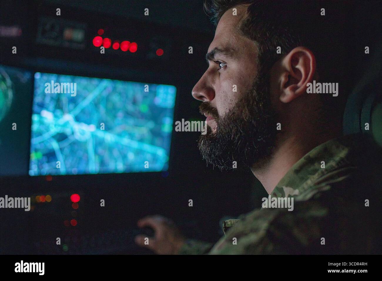 One of the series of photos : Military Analyst looking at large map ...