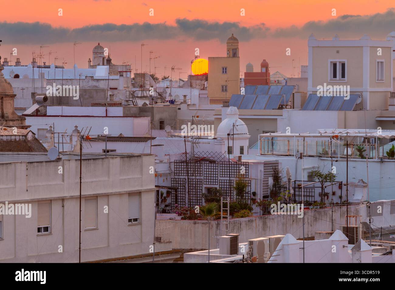 Rooftop view of historic buildings in Cadiz, Spain, during sunset with ...