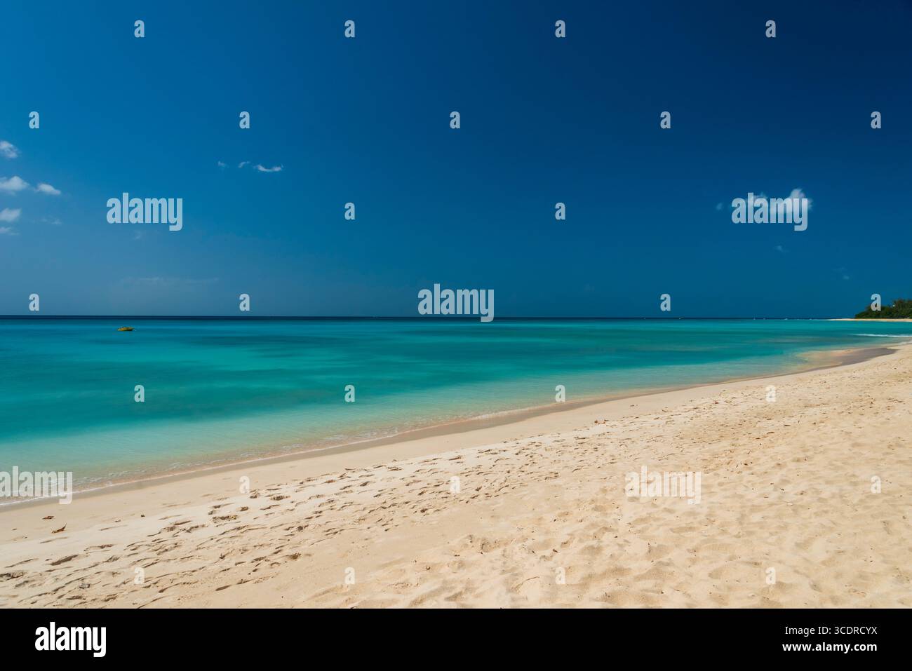 Blue sky and beautiful, deserted, golden sandy beach and azure ocean in ...