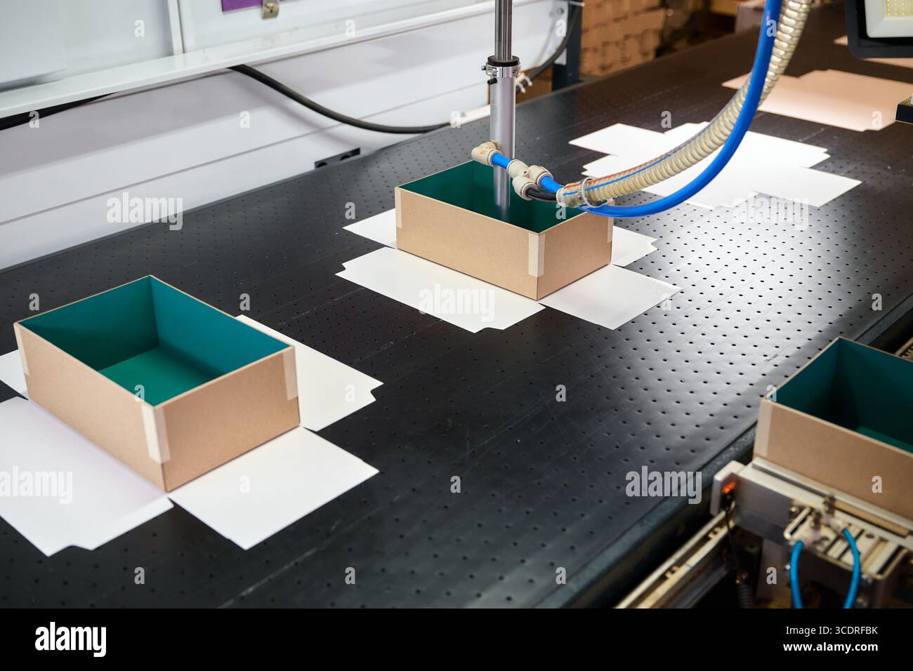 Efficient automation in a decorative box factory with a robot ...