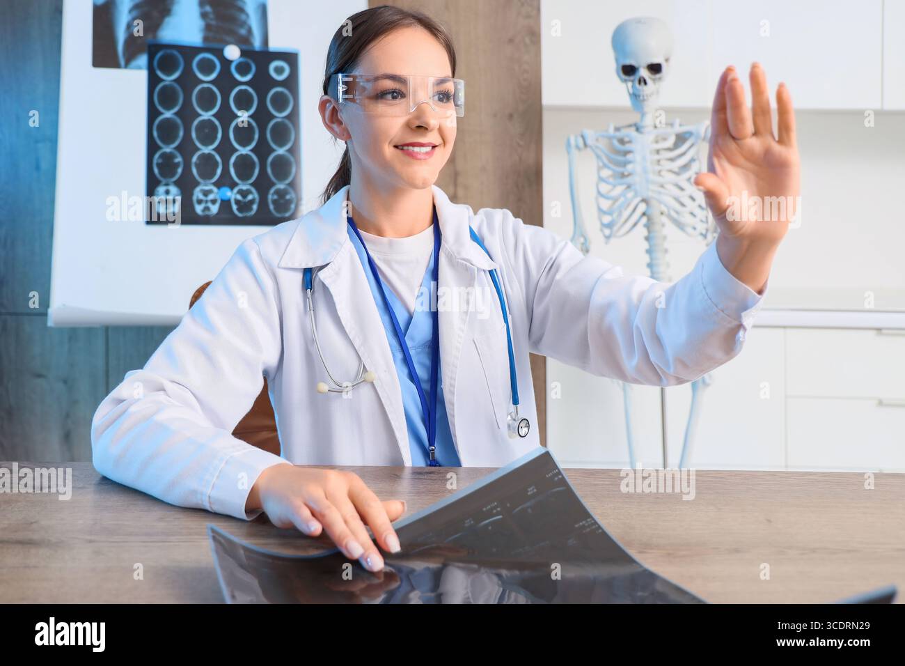 Female doctor in goggles with MRI scan using virtual screen at hospital ...