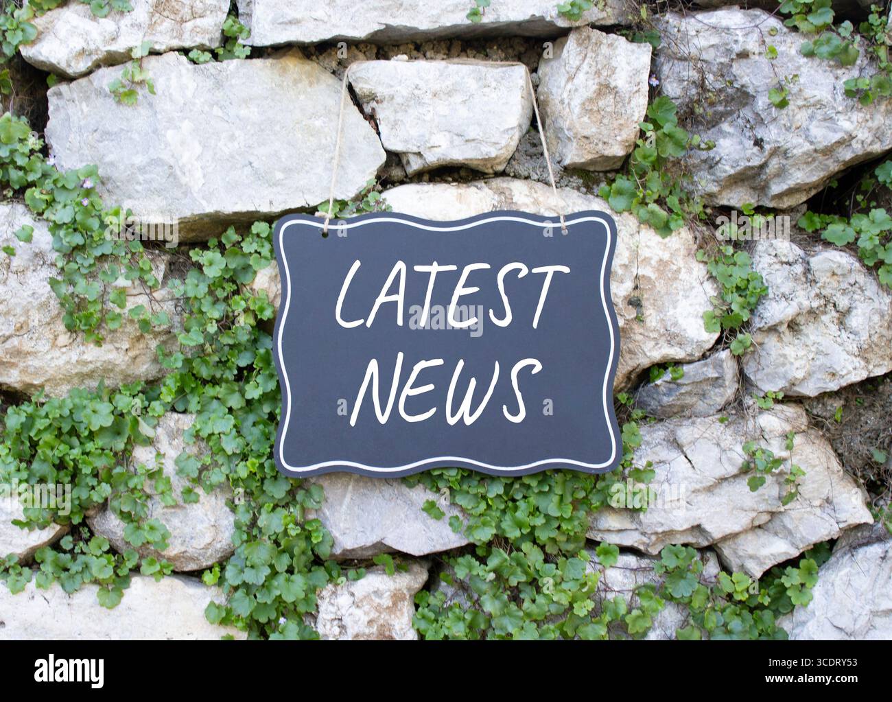 Latest News symbol. Stone wall with words Latest News. Beautiful stone ...