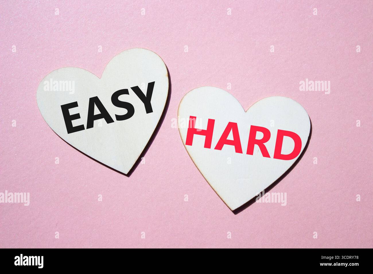 Easy or Hard symbol. Concept word Easy or Hard on wooden hearts ...