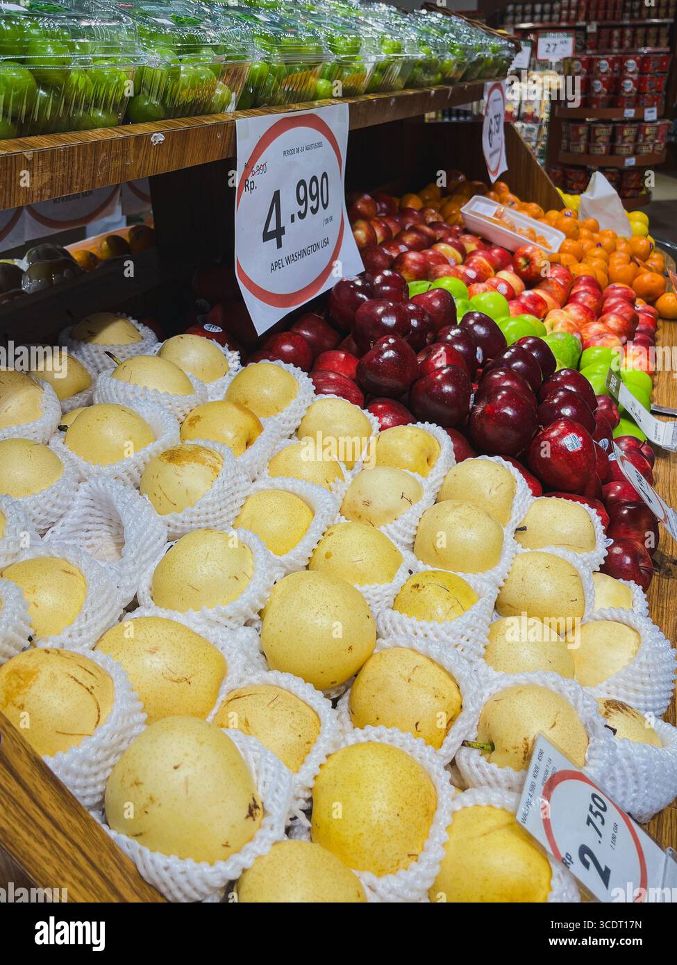 Balikpapan, Indonesia - August 12 2025. fresh fruit in the produce aisle of a grocery store ...