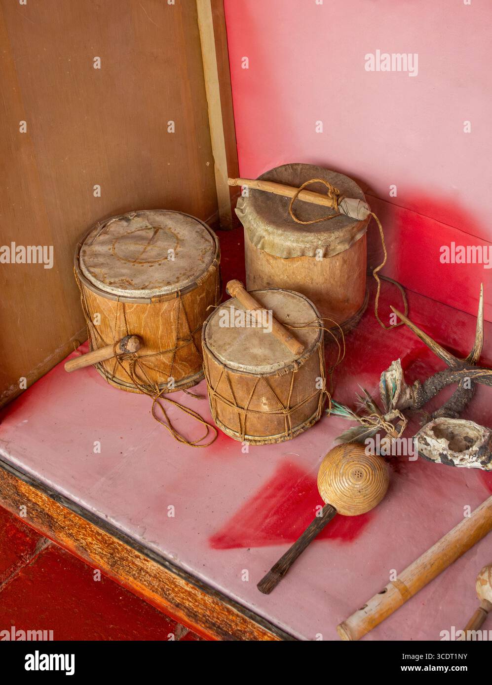 A collection of traditional drums and instruments displayed in the Sun ...