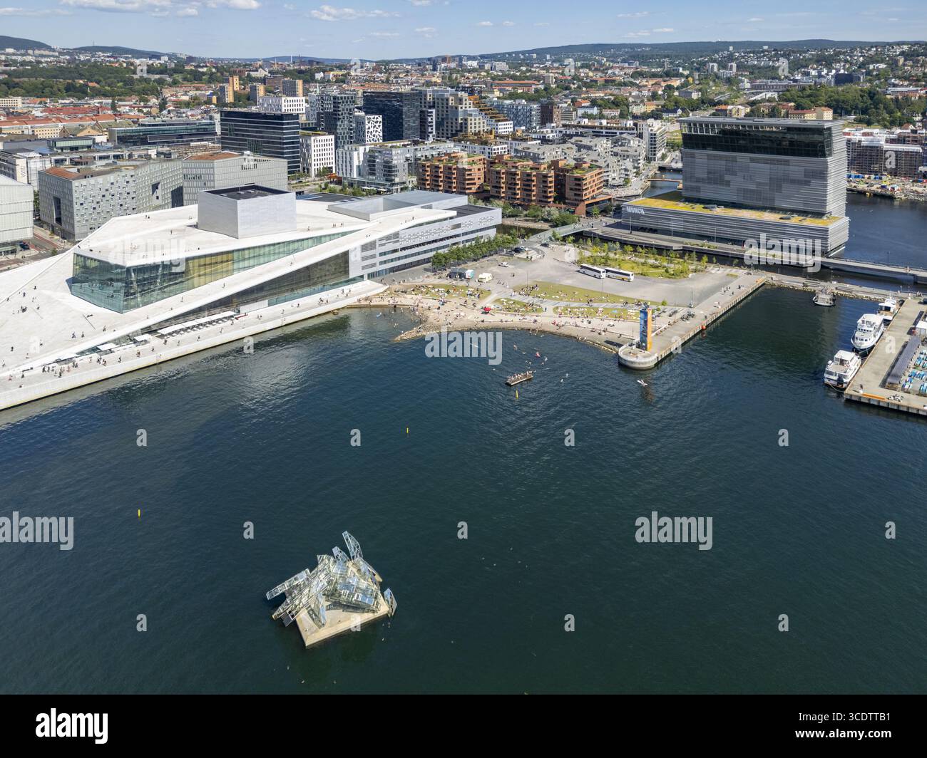 Aerial view of the Oslo Opera House's white marble reflecting the clear ...