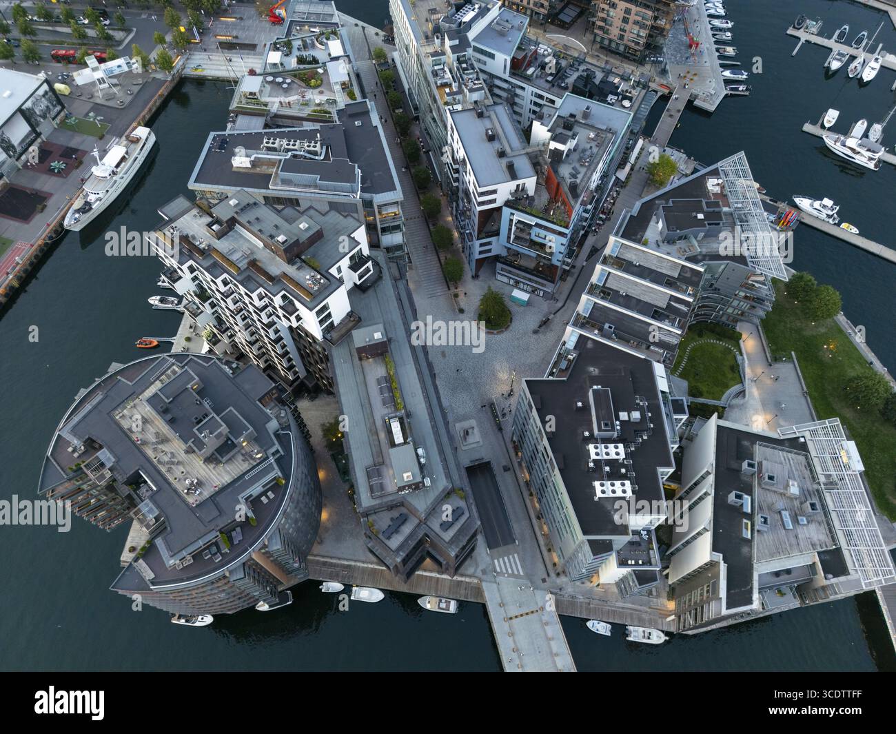 Aerial view of modern architecture reflecting in the dark waters of the ...