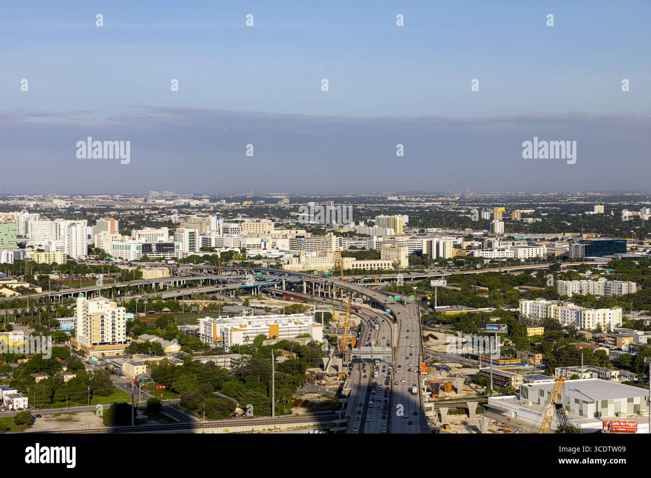 Aerial view of the cityscape, where sunlight kisses the tops of ...