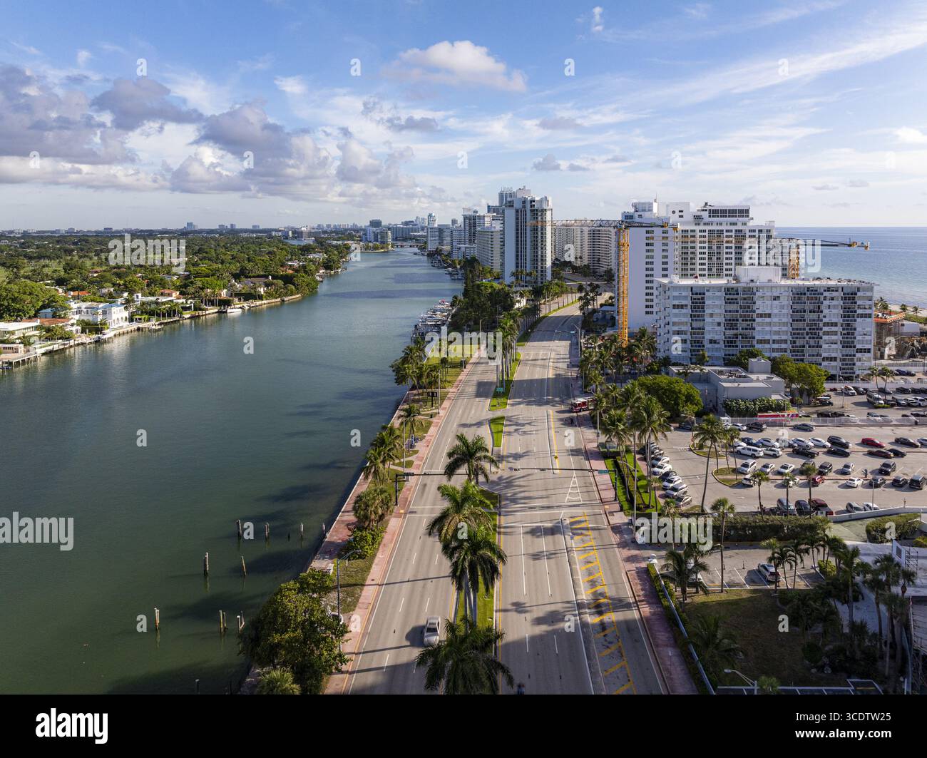 Aerial view of Collins Avenue flanked by the still intracoastal ...