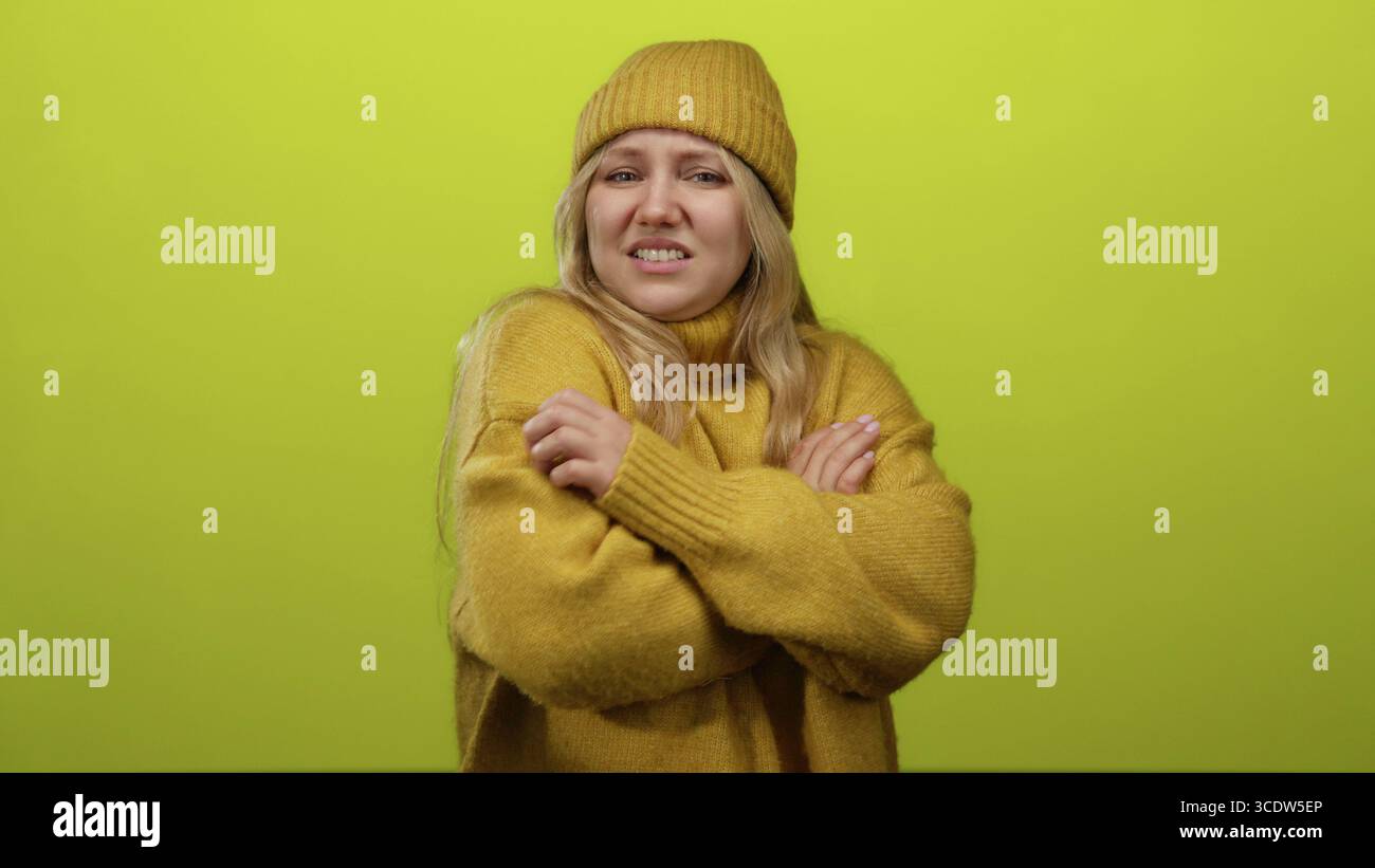 Woman shivering in yellow sweater hi-res stock photography and images ...