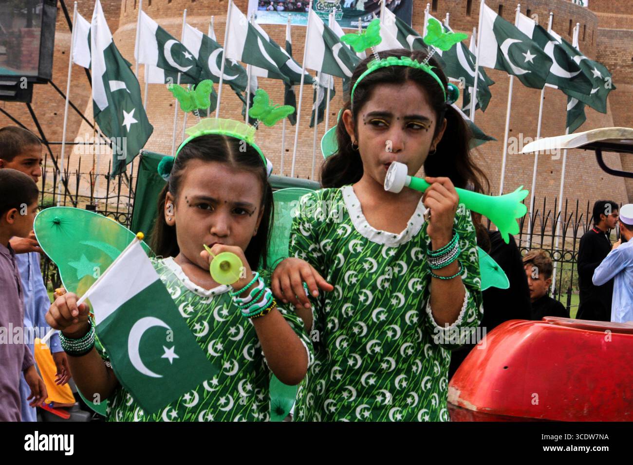 Girls wear national flag colors clothes as they celebrate the Pakistan ...