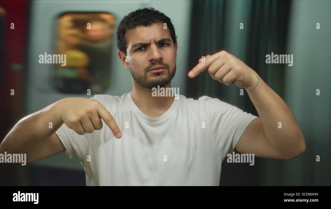 Young latino man moving index hi-res stock photography and images - Alamy