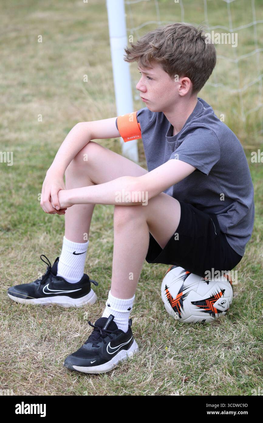 Sitting soccer ball on hi-res stock photography and images - Alamy