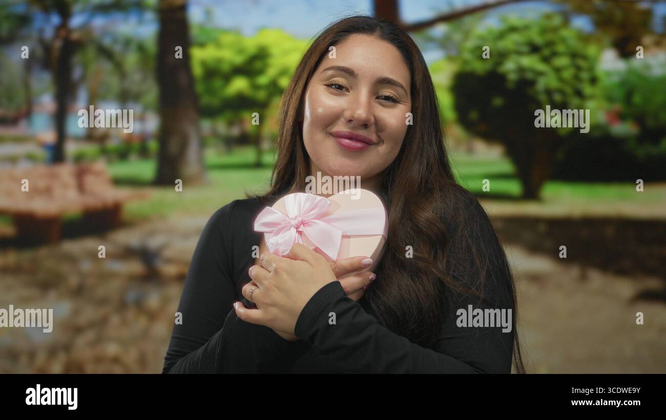 Woman hugs box against chest hi-res stock photography and images - Alamy