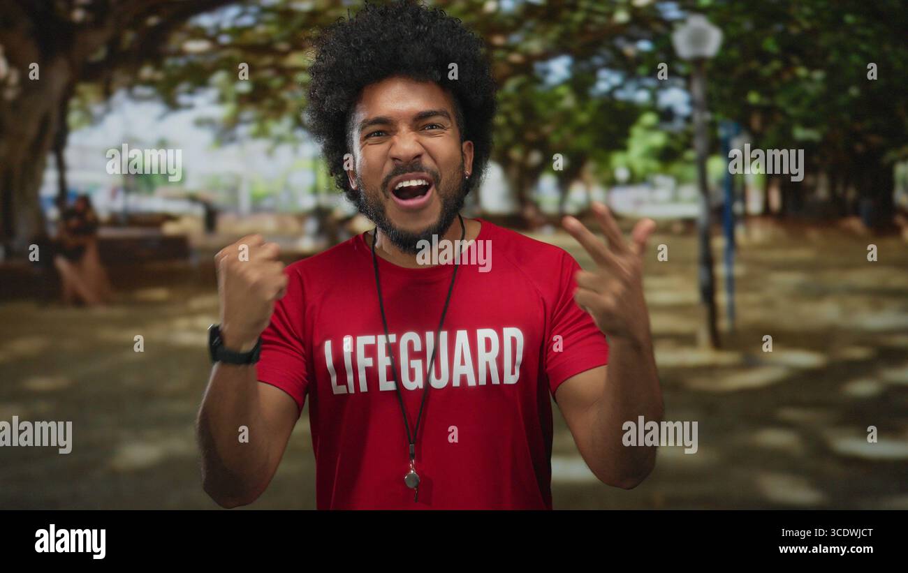 Lifeguard man celebrating success in hi-res stock photography and ...
