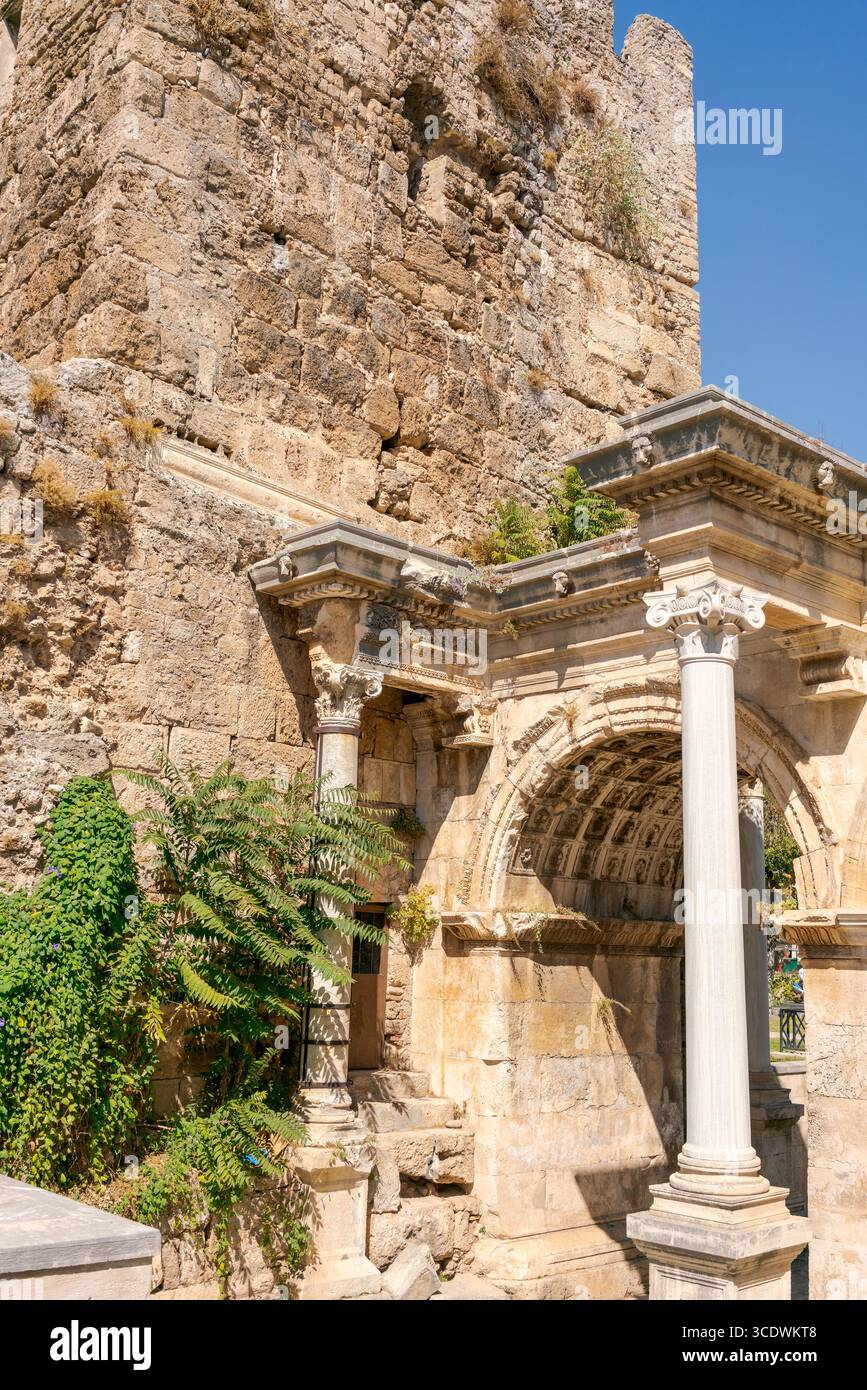 Stone building with a large archway. The archway is open and has a ...
