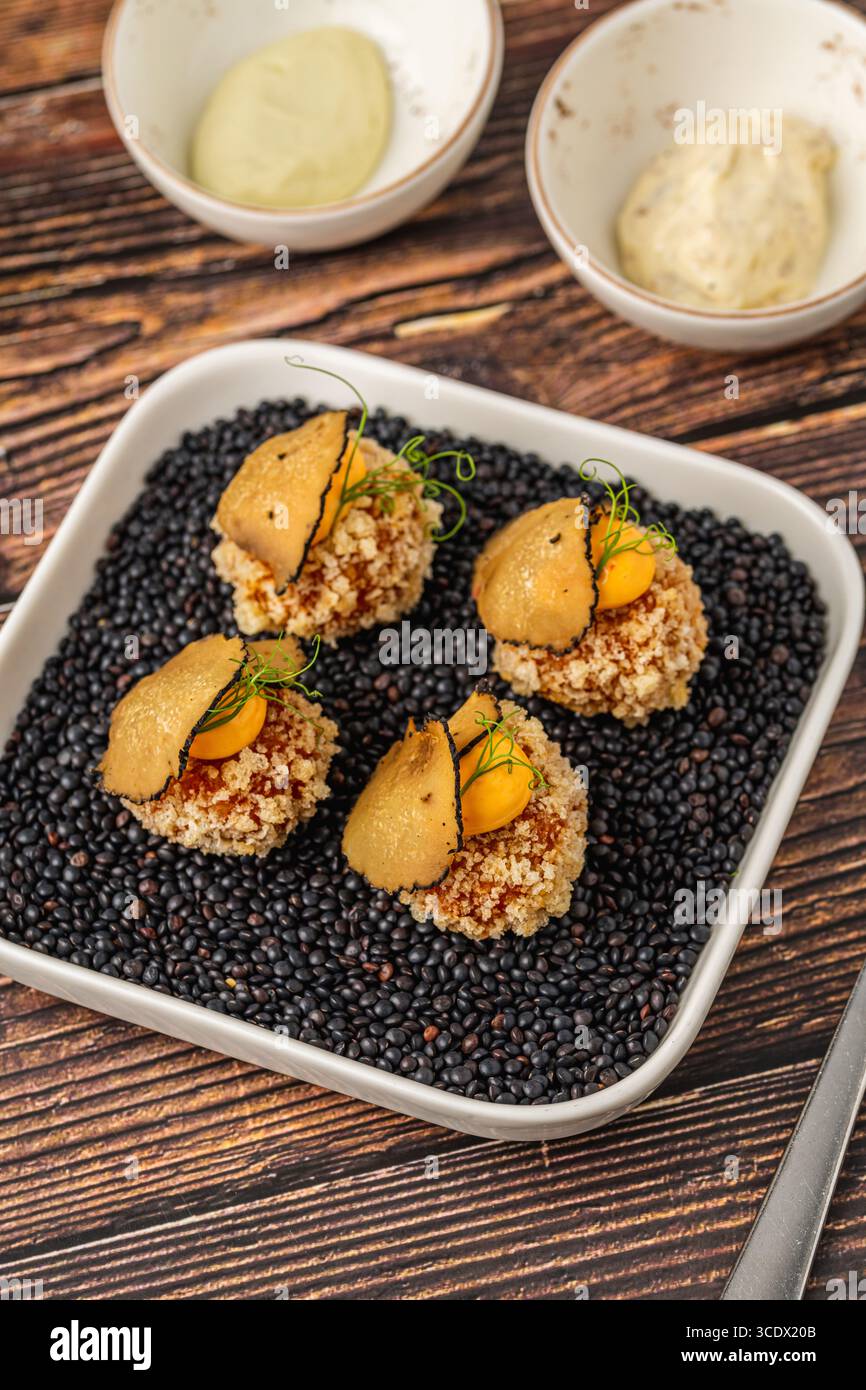 Gourmet quinoa balls with crispy texture and artistic garnish Stock ...