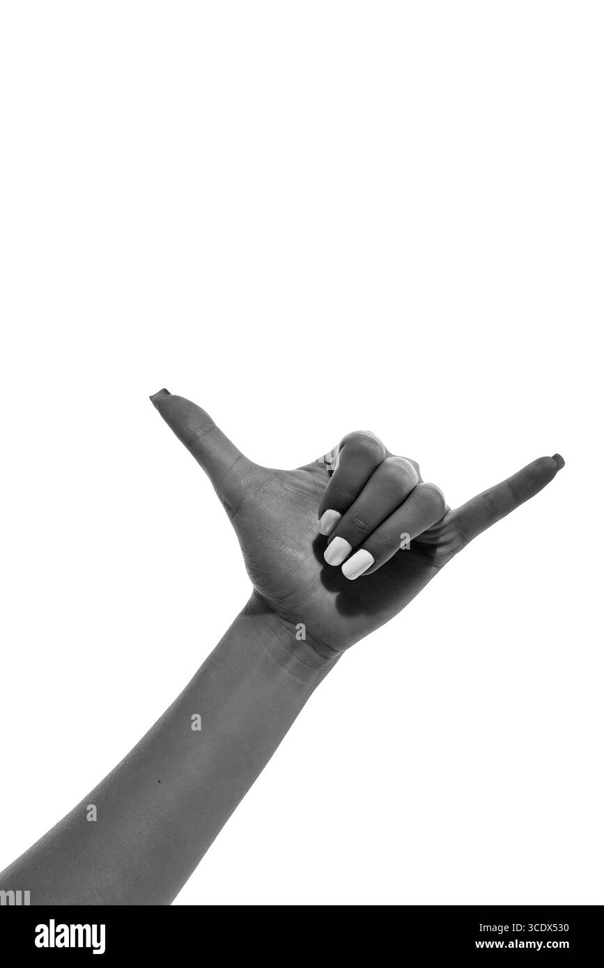 Black and white hand showing shaka sign with white manicure isolated on ...