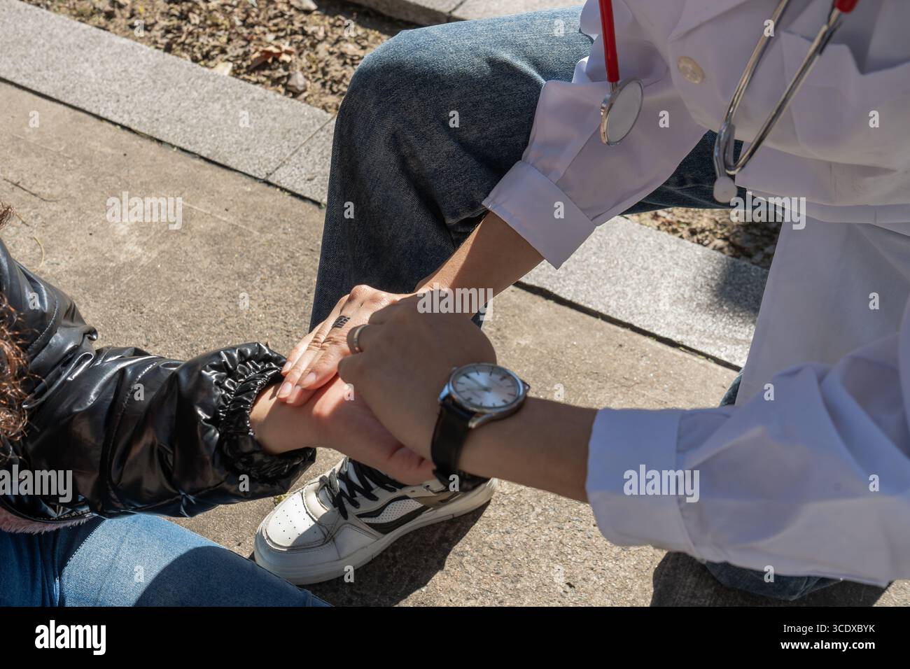 Medical professional providing comfort and support to patient by ...