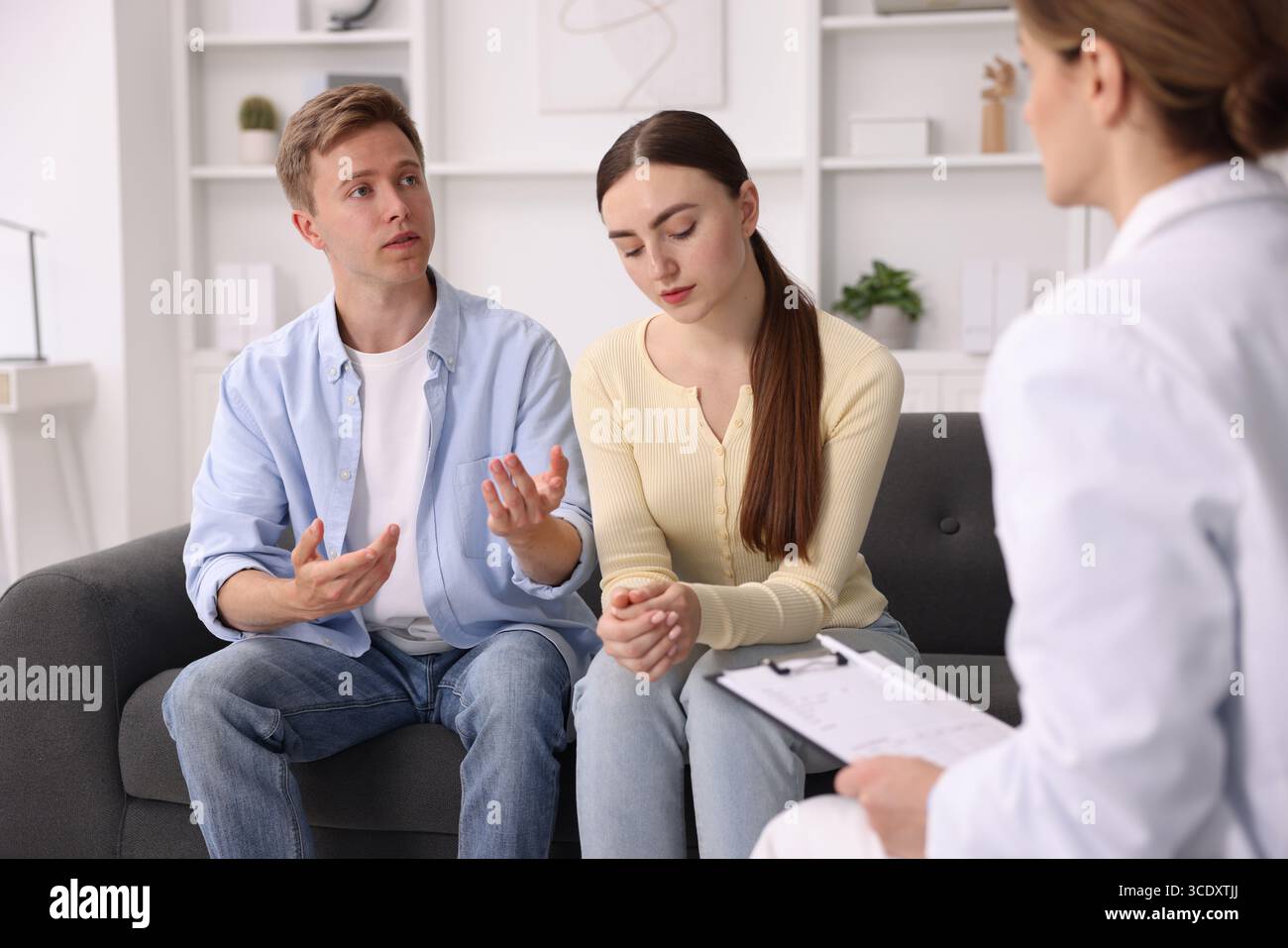 In vitro fertilization (IVF). Couple having appointment with doctor in ...