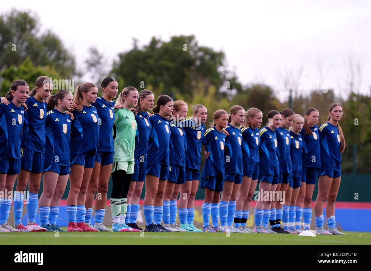 Young girls line up ahead of playing football during the FIFA Milestone ...
