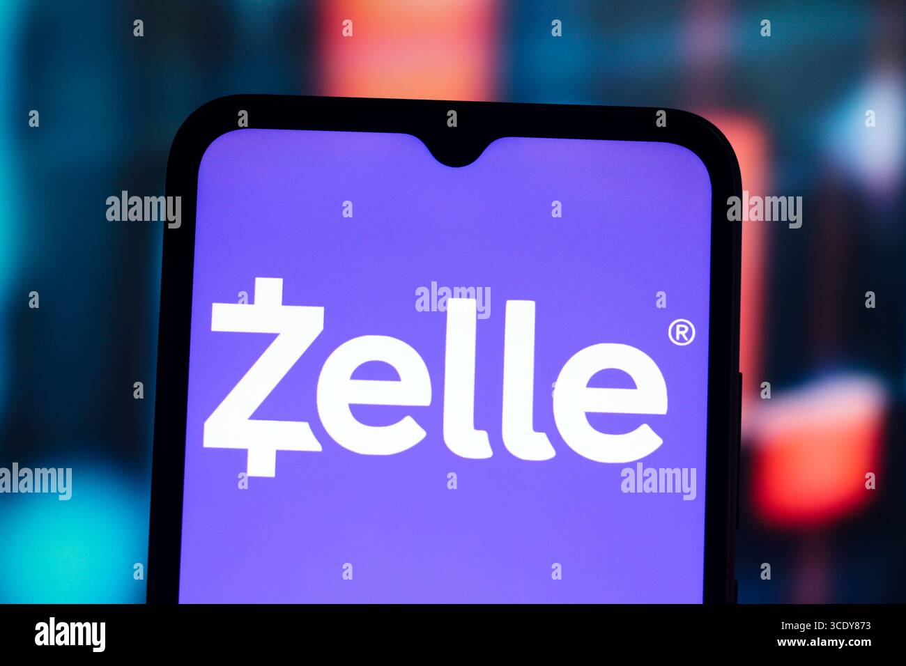 In this photo illustration, the Zelle logo is seen displayed on a ...