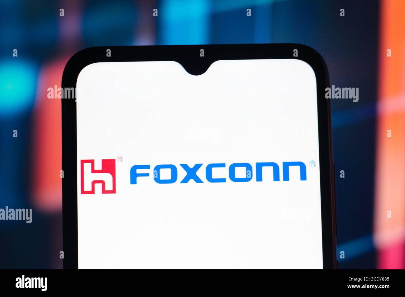 In this photo illustration, the Foxconn logo is seen displayed on a ...