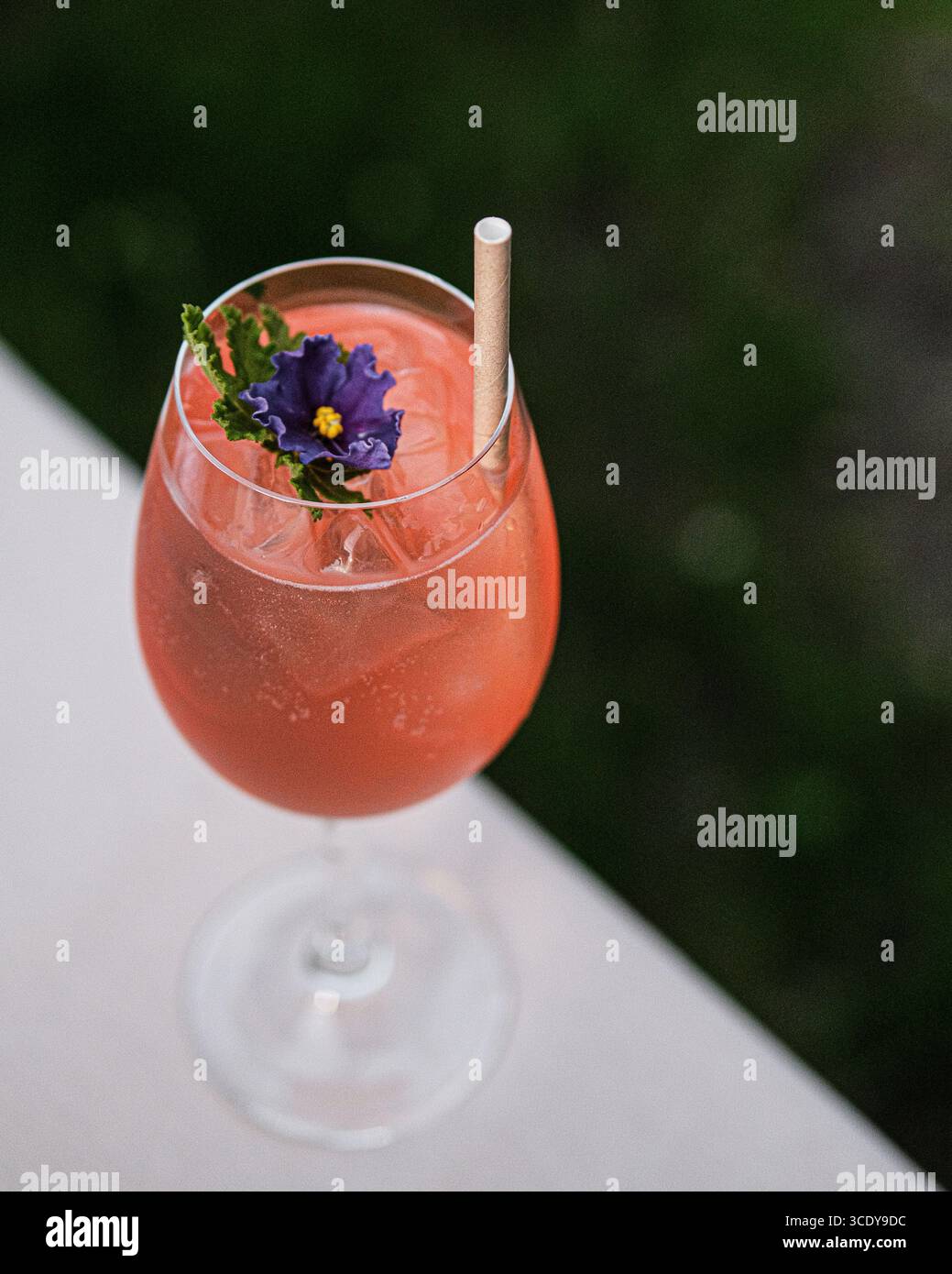Enjoy a refreshing summer cocktail with a beautiful edible flower ...