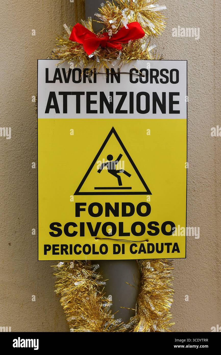 Warning sign: "Work in Progress - Attention Slippery Surface - Risk of ...