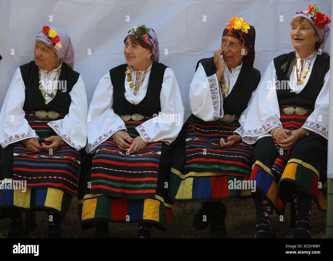 People in traditional folk costume of The National Folklore Fair in ...