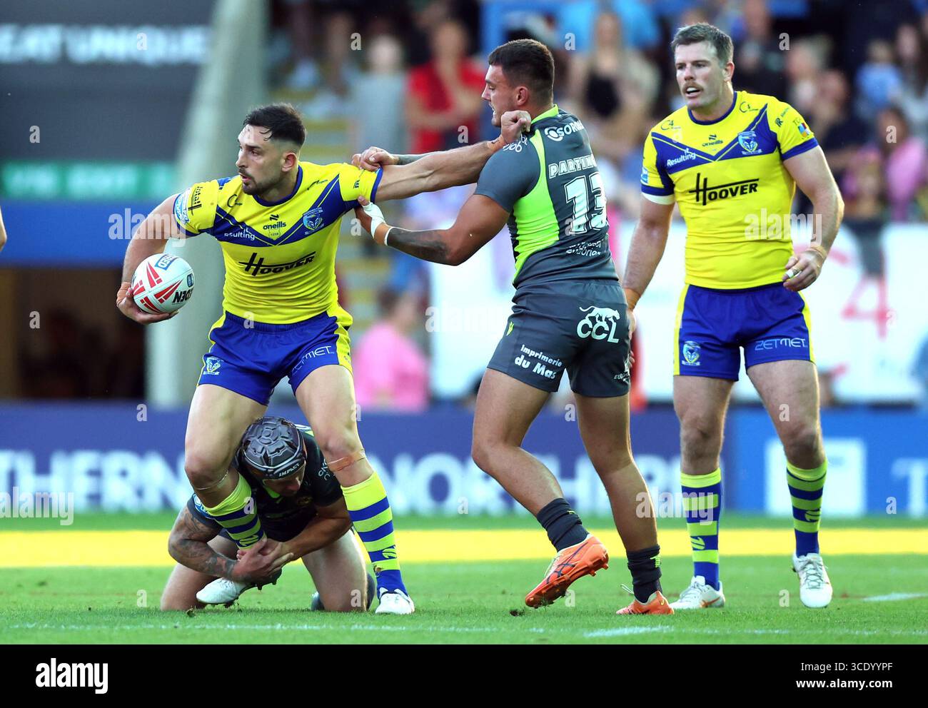 Warrington Wolves’ Ryan Matterson is tackled Catalans Dragons’ Guillermo Aispuro-Bichet and ...
