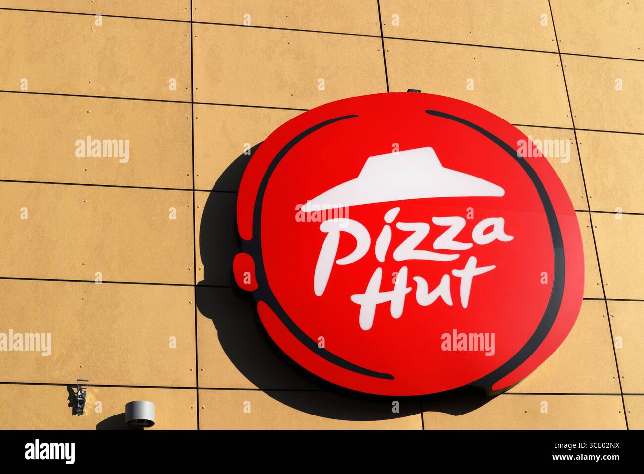 Pizza hut sign on a wall outside one sunny Swedish April day. American fast food restaurant ...