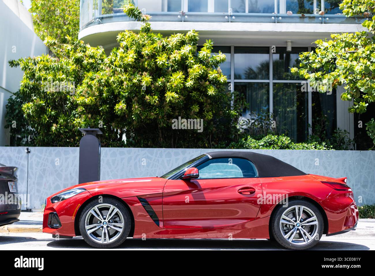Miami, Florida, USA - April 13, 2025: Red roadster car, side view. BMW ...