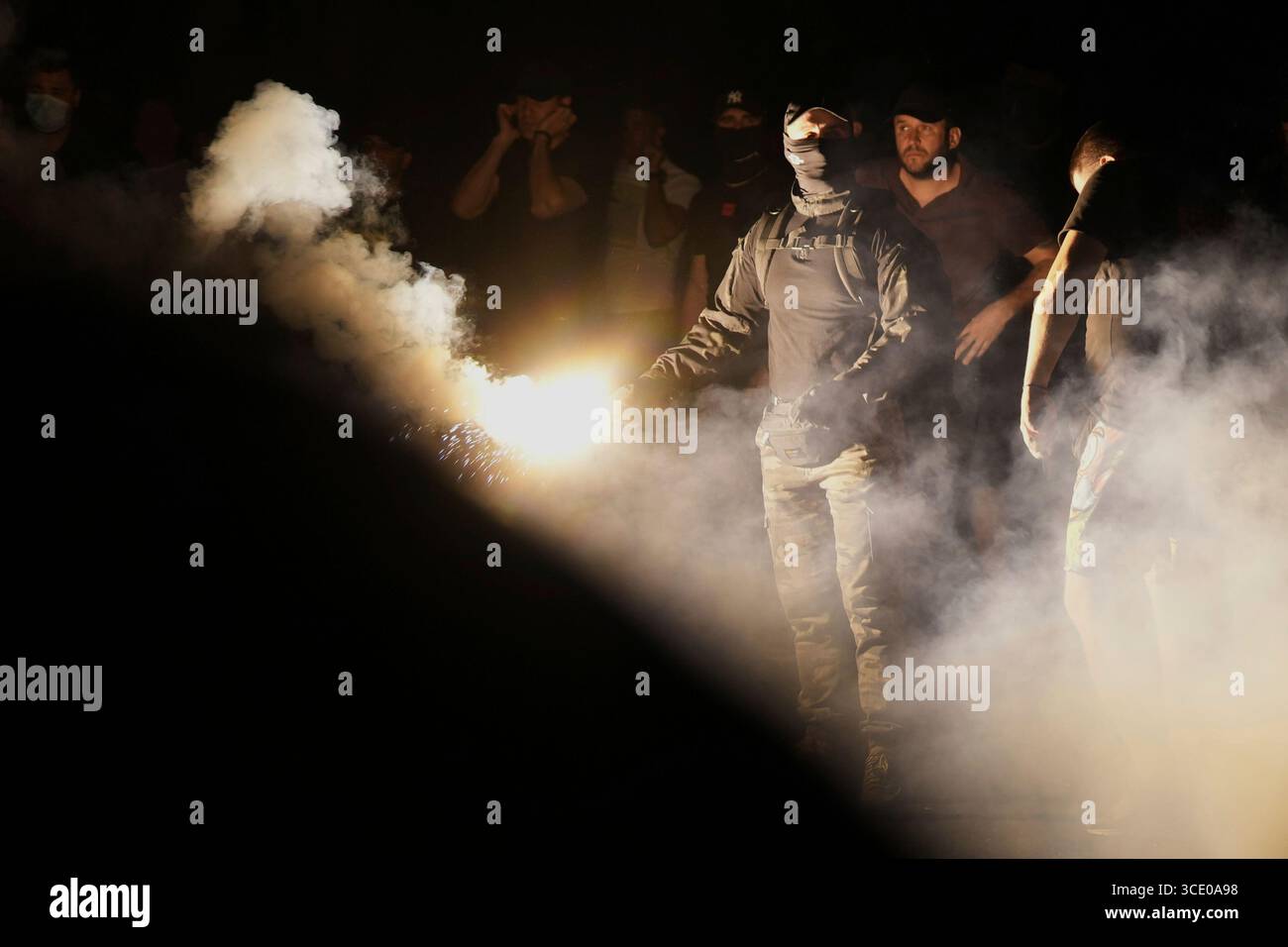 Supporters of Serbian President Aleksandar Vucic hurl flares at anti ...