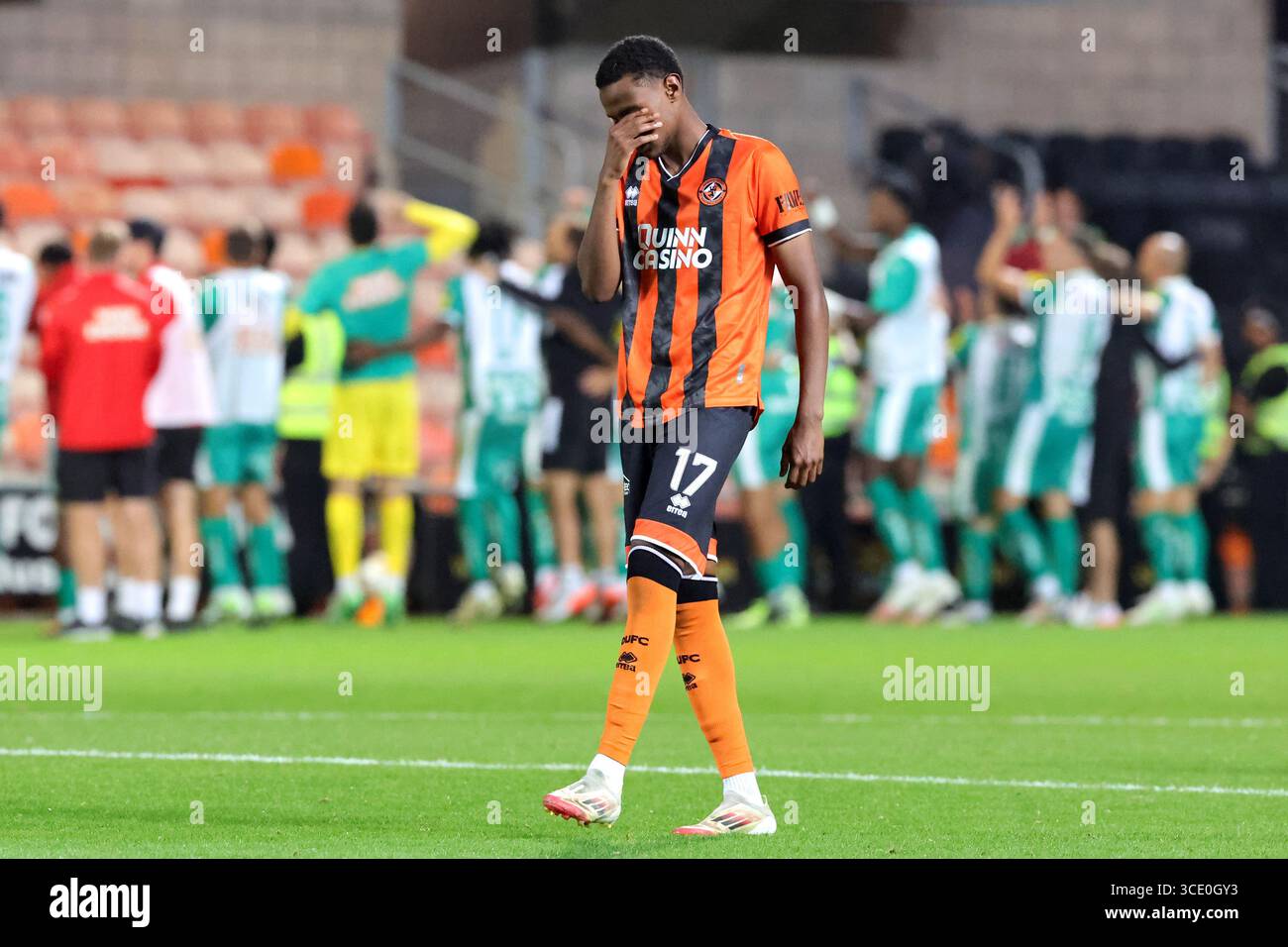 Dundee United's Amar Fatah looks dejected following defeat in the ...
