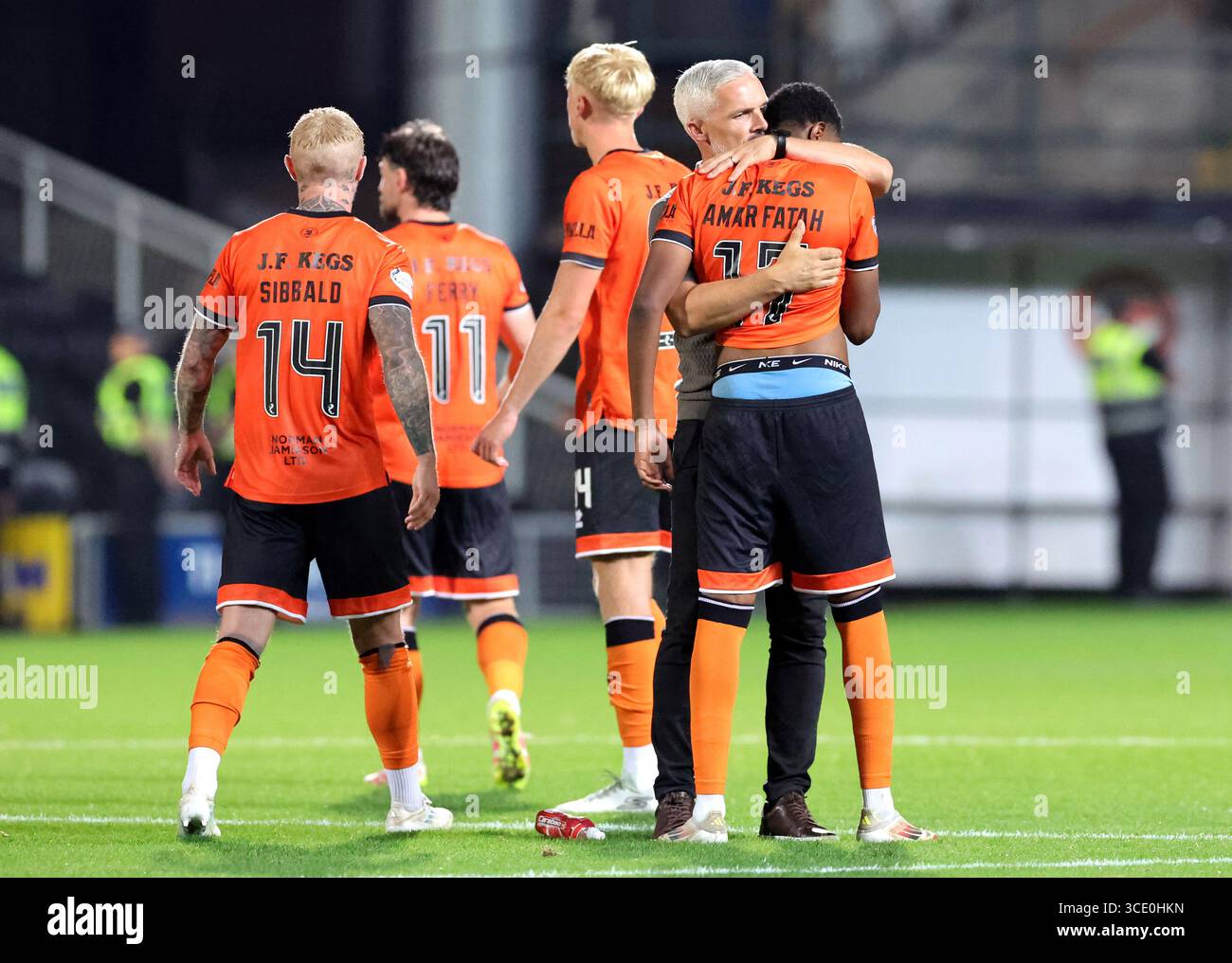 Dundee United's Amar Fatah is consoled by manager Jim Goodwin following ...