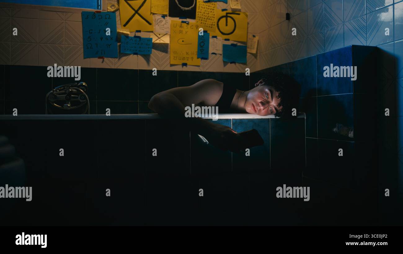 Sad And Lonely Man Doomscrolling At The Bathroom Stock Photo - Alamy